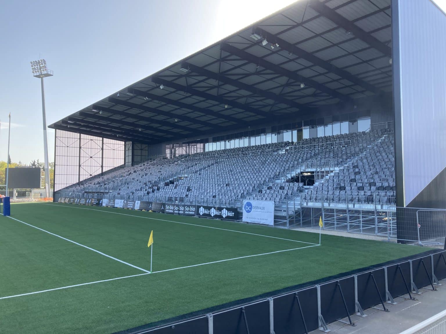 Difference between grandstand, bleachers, and stands